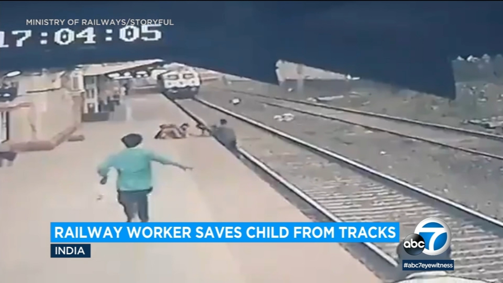 Surveillance video shows the moment a railroad worker rescues a child ...