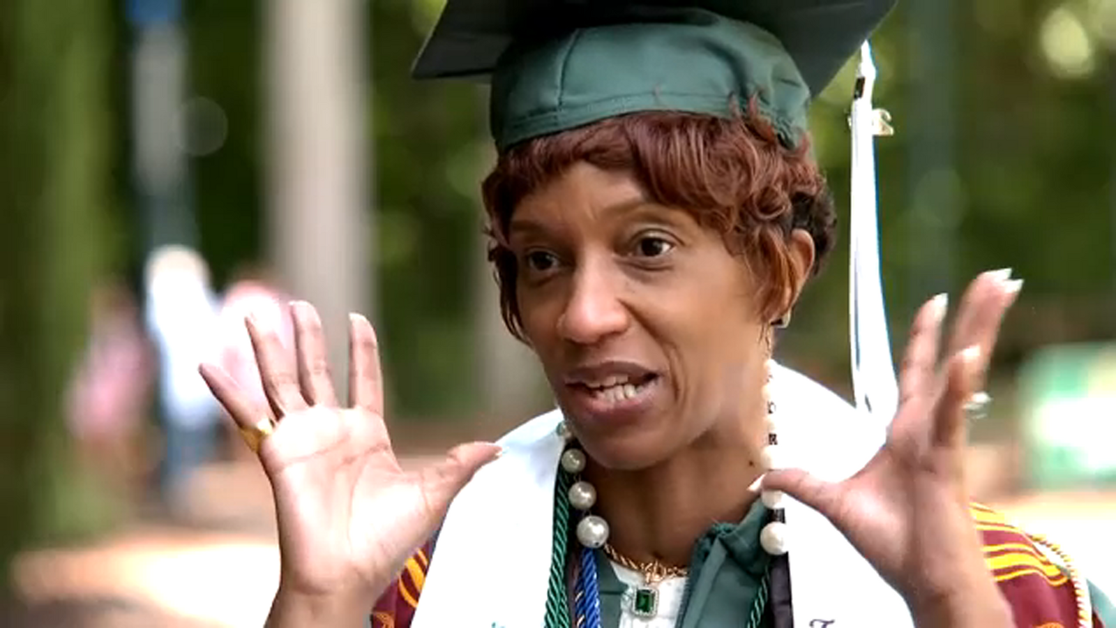 'Sunshine after the rain': Deaf mother of 2 graduates from UNC ...