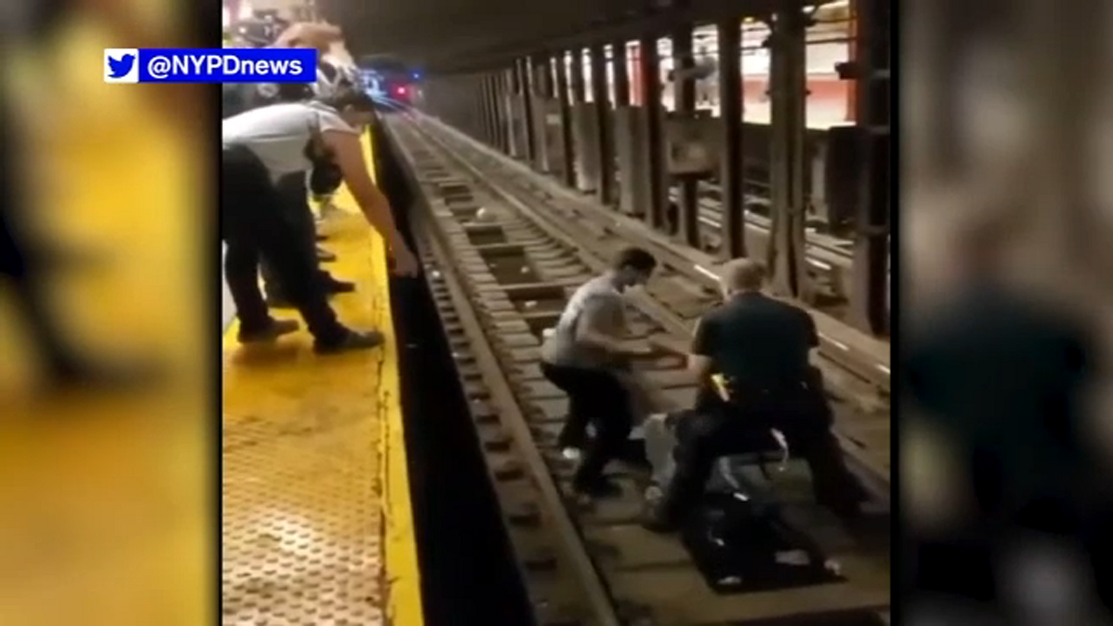 Dramatic video shows NYPD officer jump onto subway tracks to save man's ...