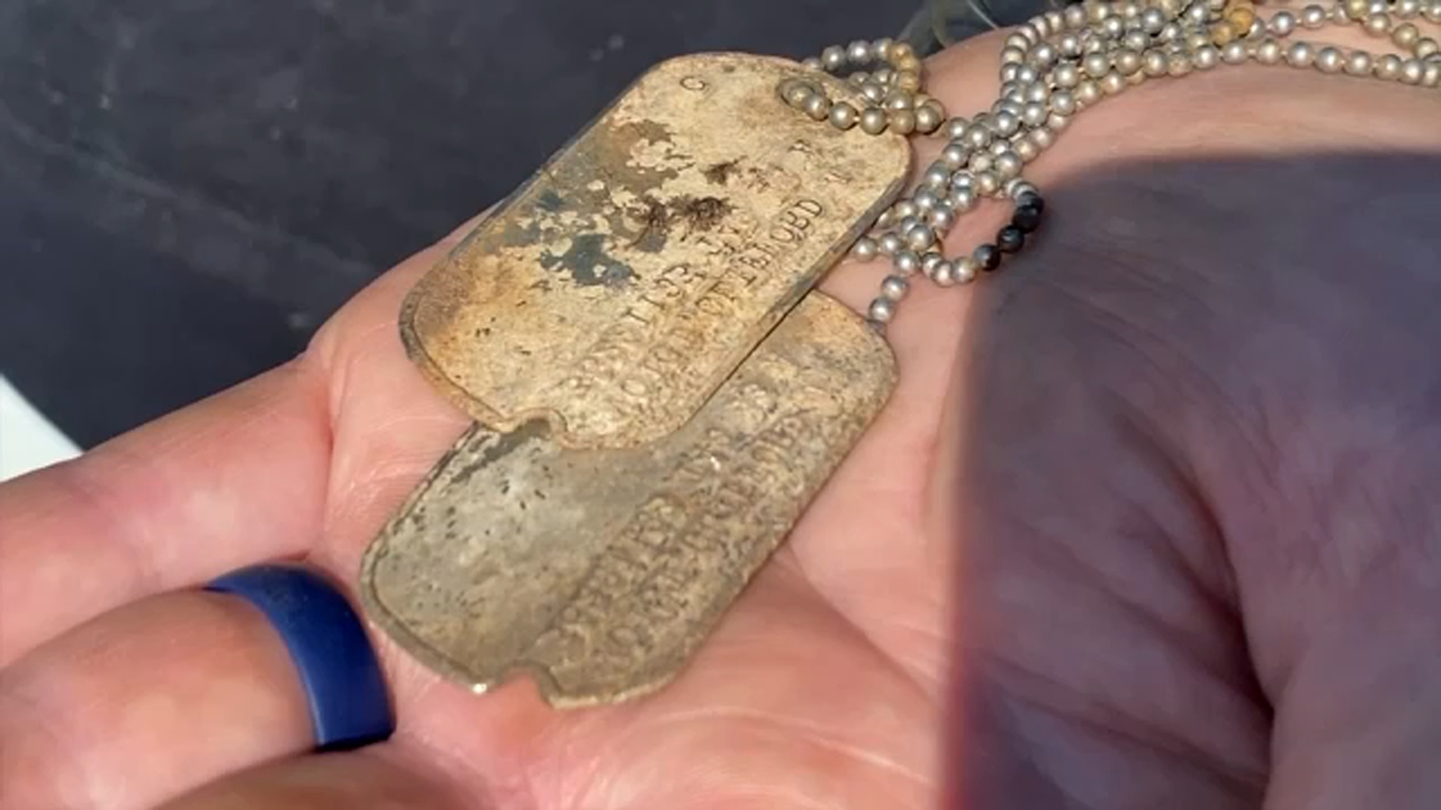 Magnet fisher finds World War II dog tags in Michigan's Grand River ...