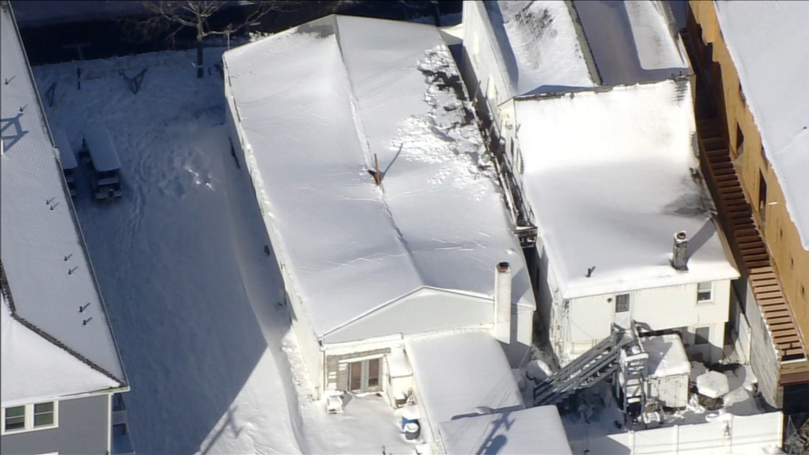 Winter Storm Aftermath: Snow-covered roof partially collapses at Jersey ...