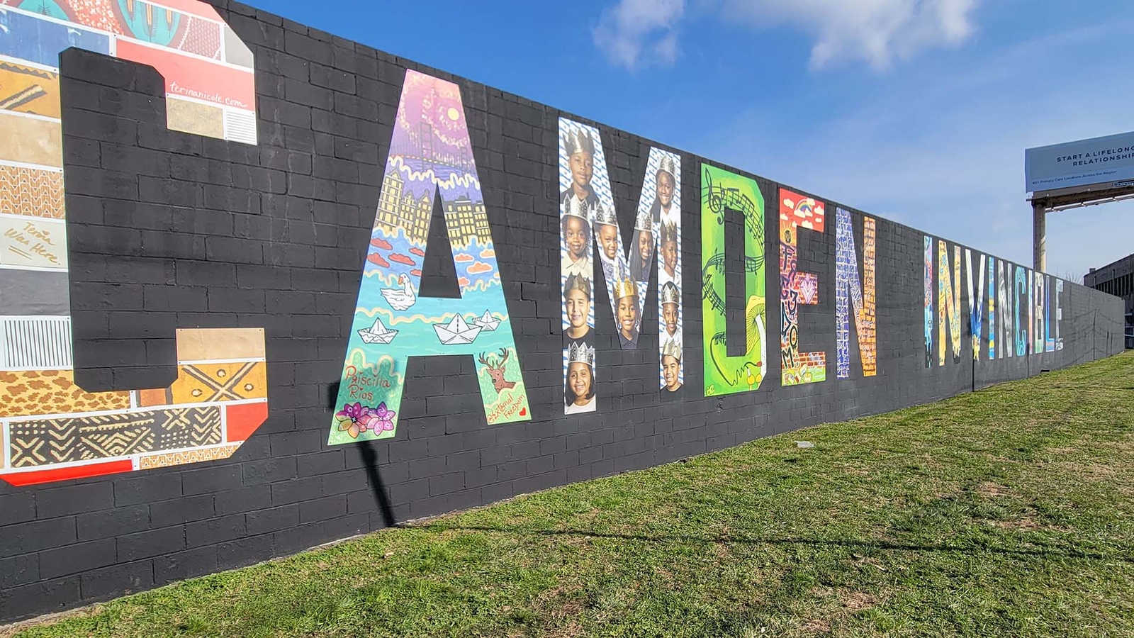 Camden mural artists spell out "Invincible" vision of city's future ...
