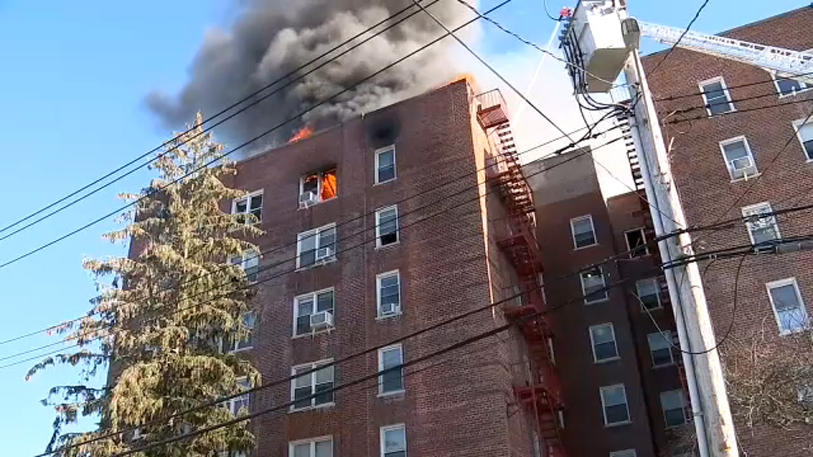 Firefighters brave elements to battle 3-alarm fire at 6-story building ...