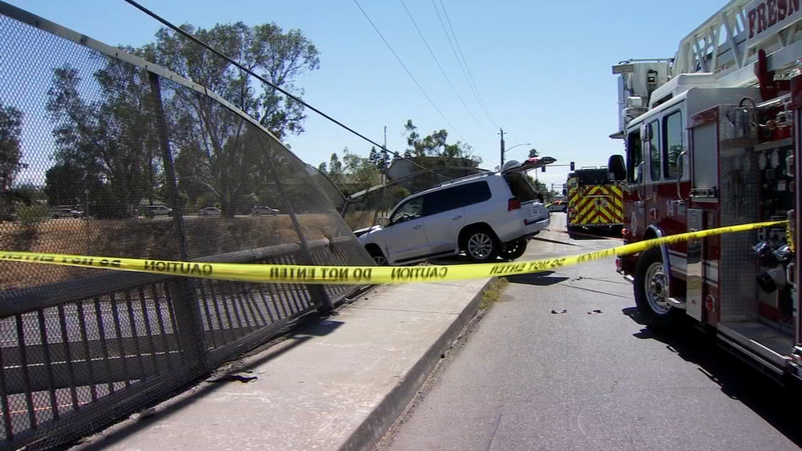 Driver rescued from crashed car dangling over Highway 99 in Fresno ...