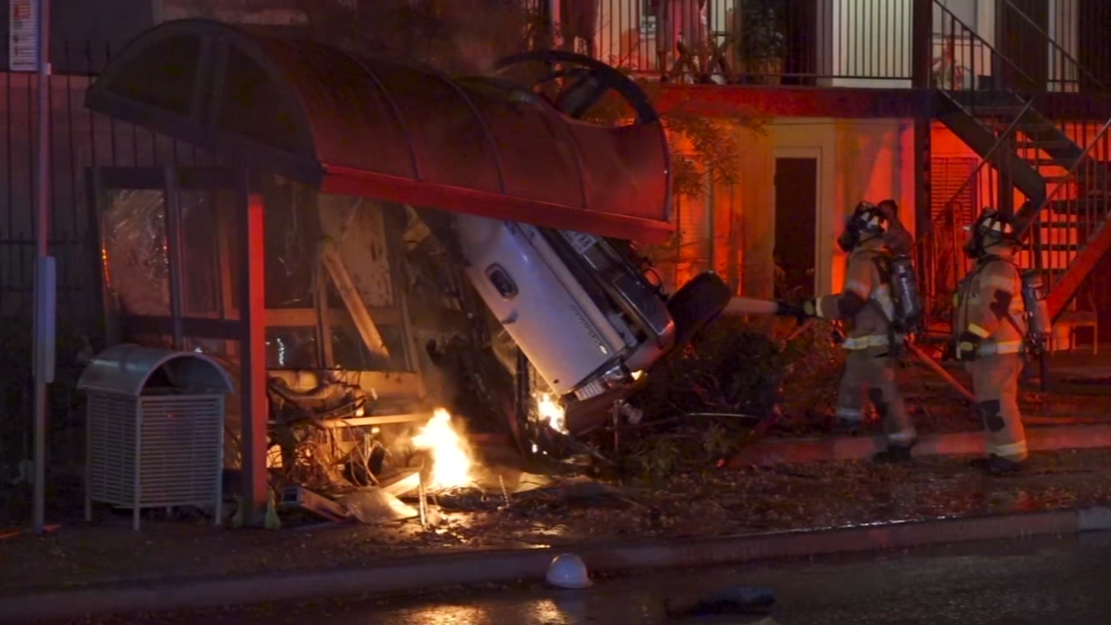 Truck catches on fire after driver loses control, hitting bus shelter ...