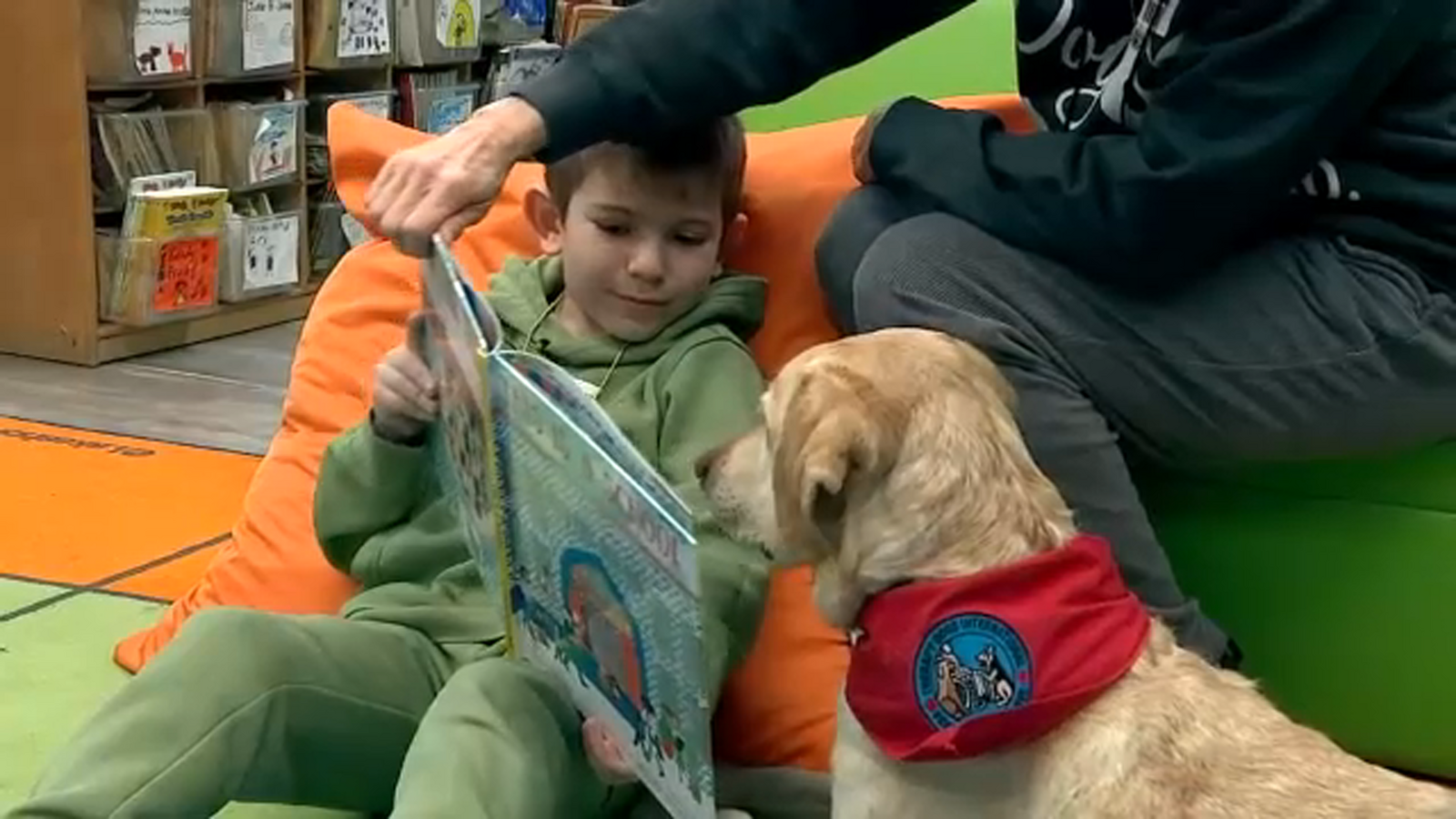 Therapy dogs help young students develop reading skills at Ogden ...