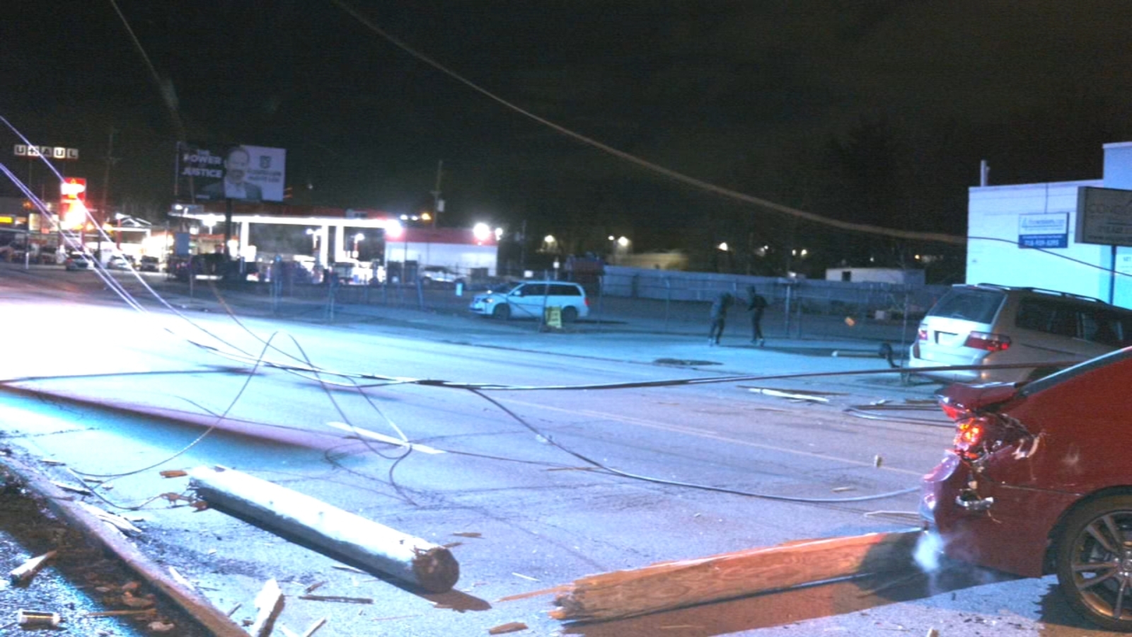 Video captures car drive through accident scene, striking live wires in ...