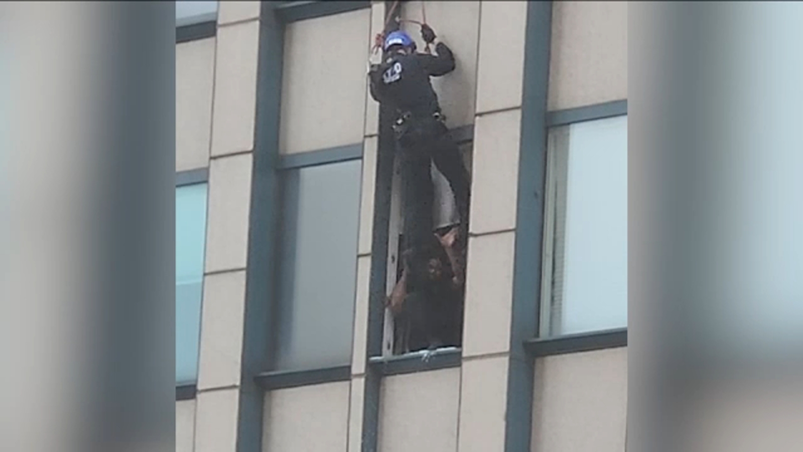 NYPD officer climbs down skyscraper to save man threatening to jump ...