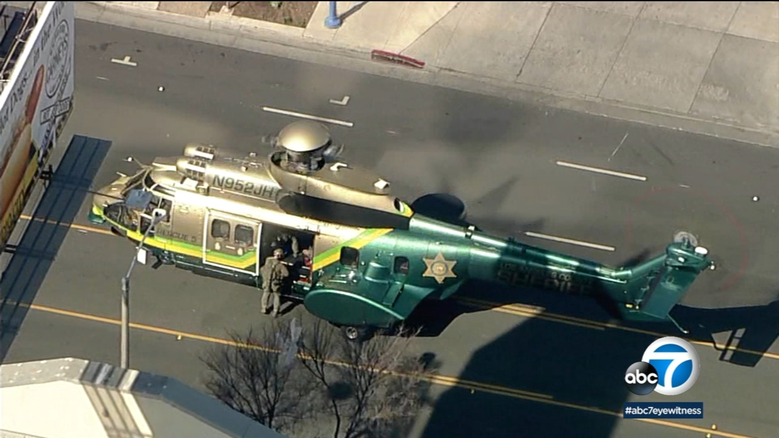 Authorities land helicopter on La Brea Avenue during shooting ...