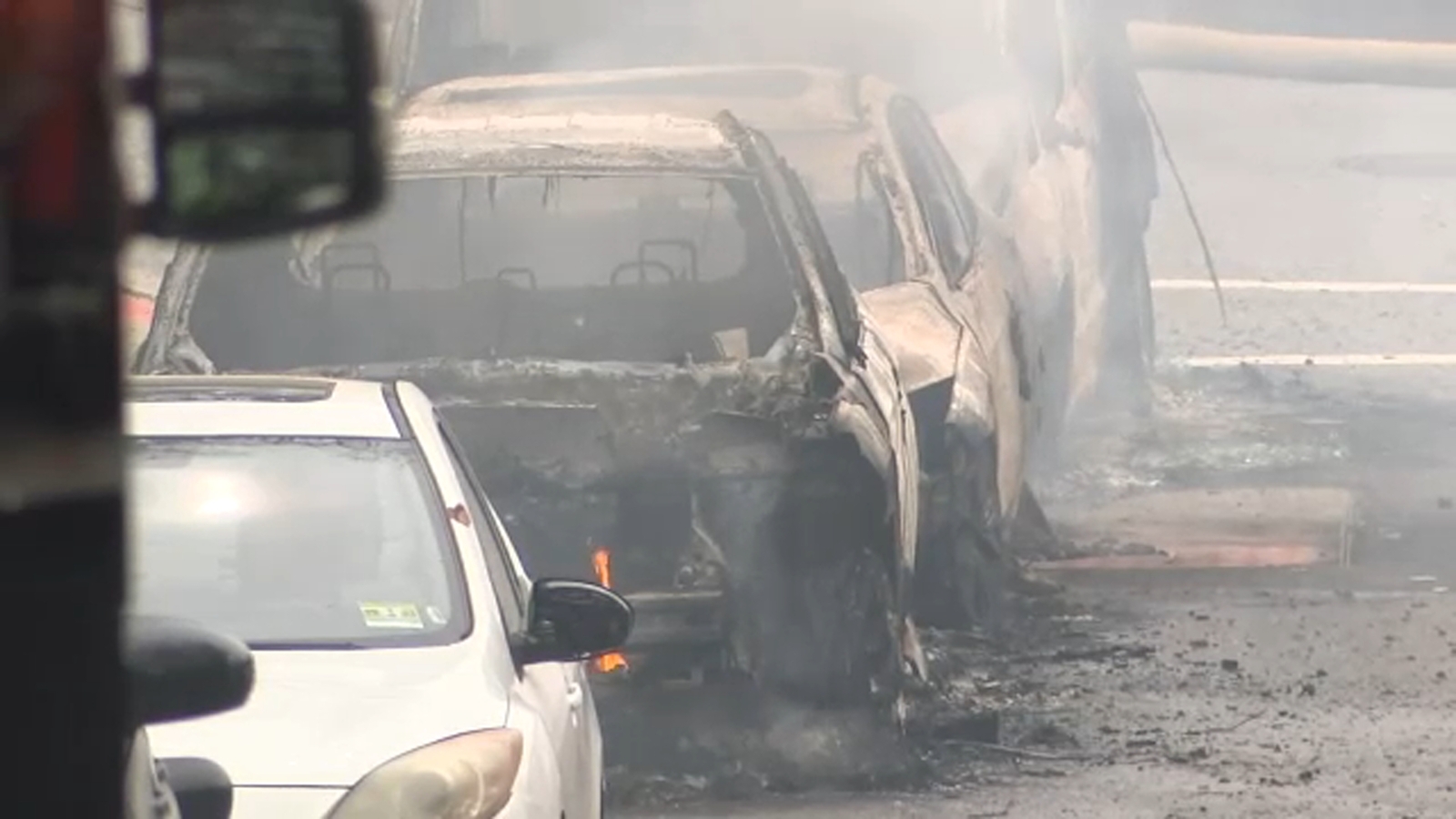 East Orange car fire: Flames spread between cars after manhole explodes ...