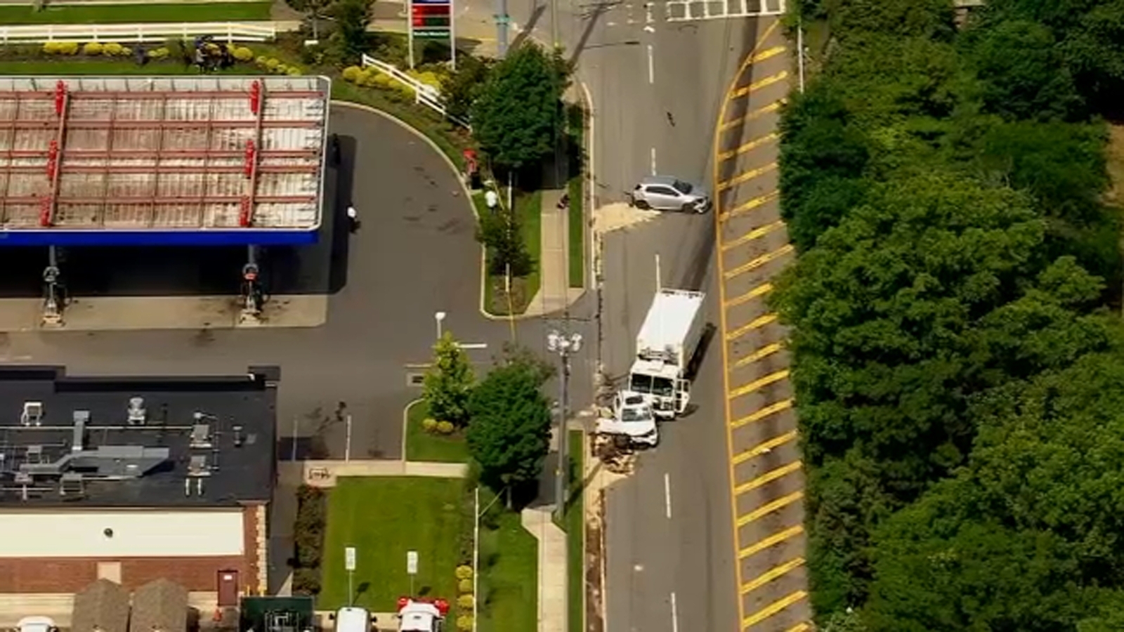 At least 1 killed when garbage truck crashes into school bus, cars ...