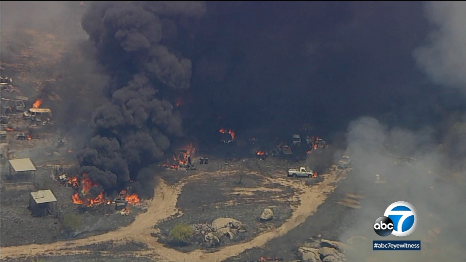 Fire engulfs several outdoor structures, abandoned vehicles in ...