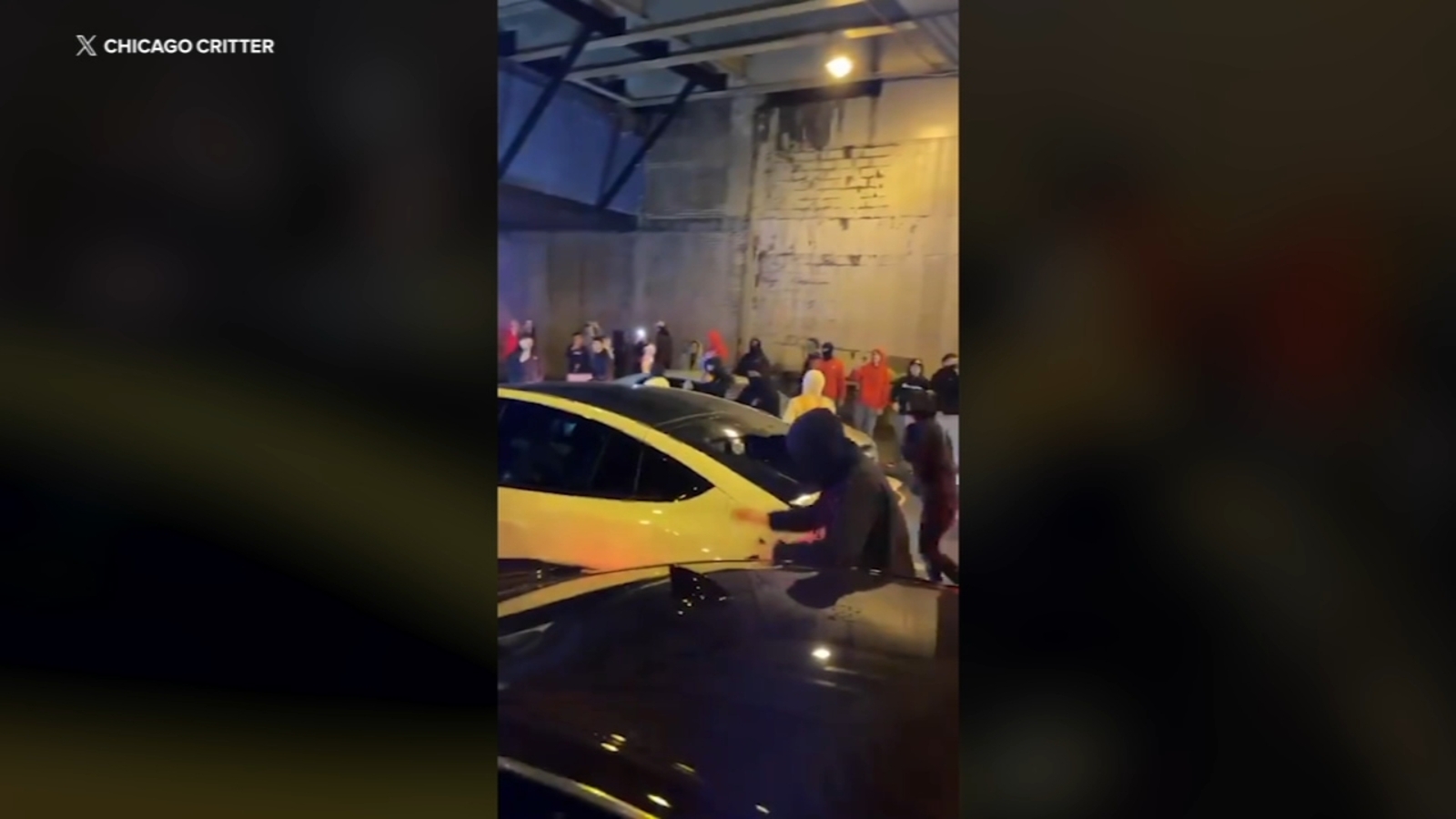 Car crash: Driver tries to escape group of people attacking vehicle in ...
