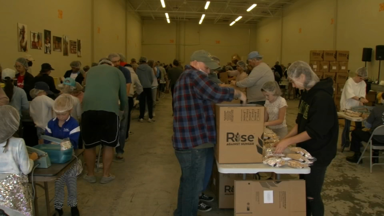 Volunteers package 250,000 meals for families in need | Rise Against ...