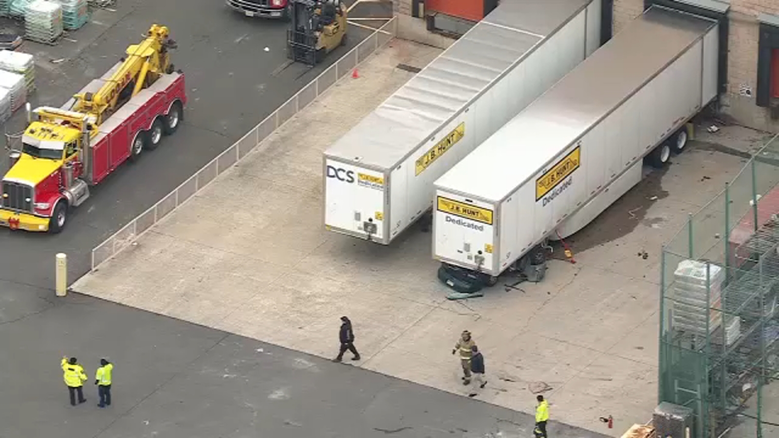 Driver killed when car wedges under semi trailer in Home Depot lot in ...