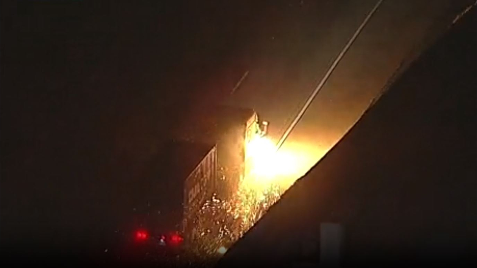 Stolen big rig catches on fire on California freeway, suspect in ...