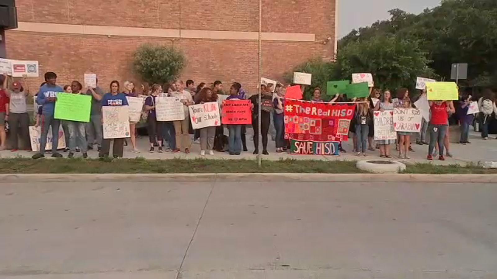 Parents protest layoffs of teachers, principals, and custodians in ...