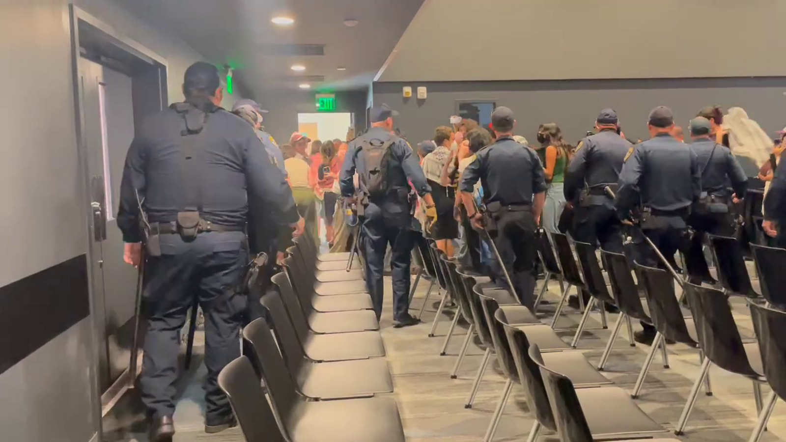 Protesters removed by officers after disrupting board of regents ...