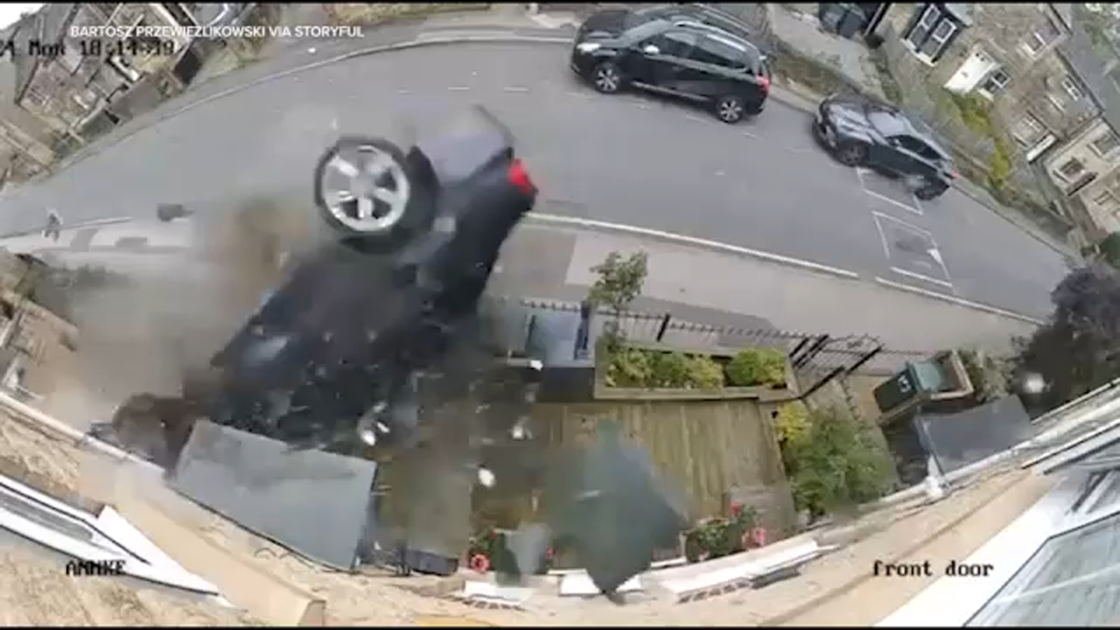 Speeding BMW skids across road, flips and crashes into United Kingdom ...