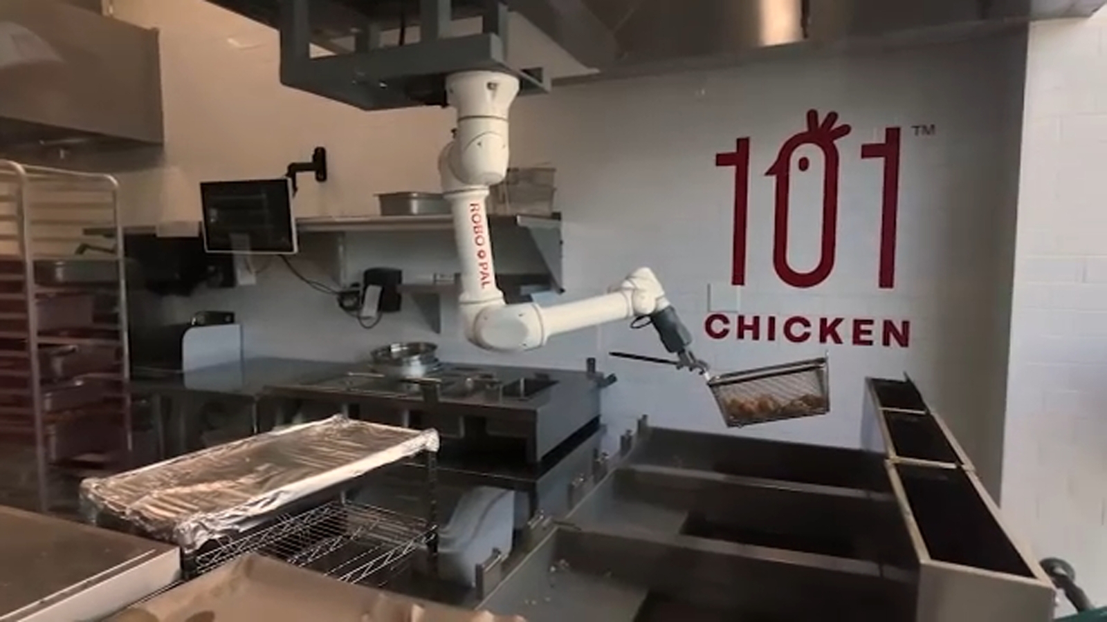 Robot chefs are cooking food at 101 Chicken, a Korean restaurant in ...