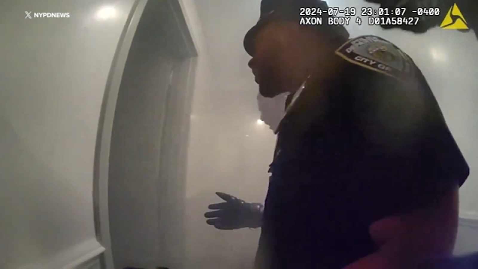 NYPD officers save woman from burning apartment in Queens, caught on ...