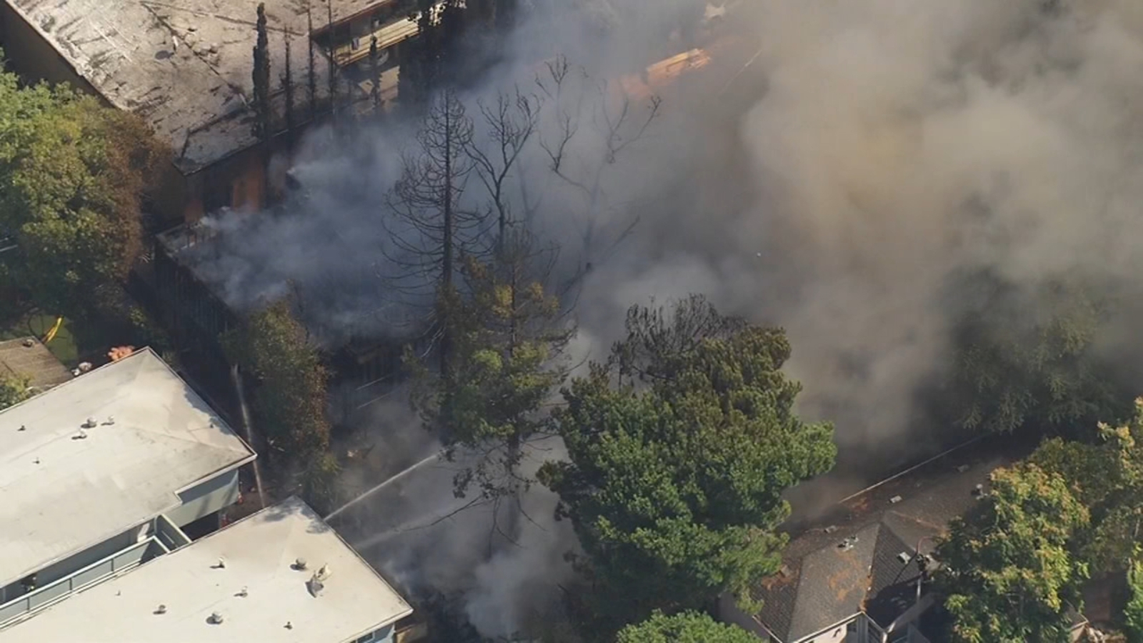 Investigation underway after crews battle house fire on Poplar Avenue ...