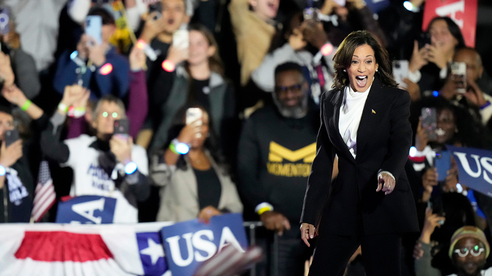 Harris both distances herself and embraces Joe Biden in closing ...