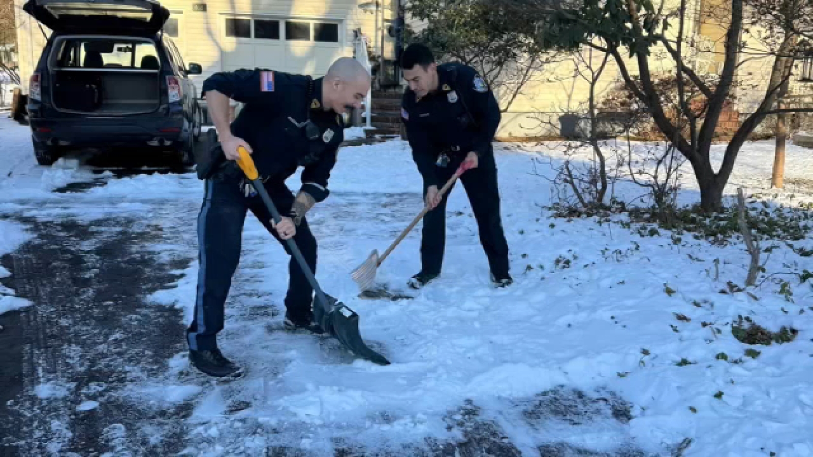 Old Tappan police officers help elderly resident shovel snow from ...