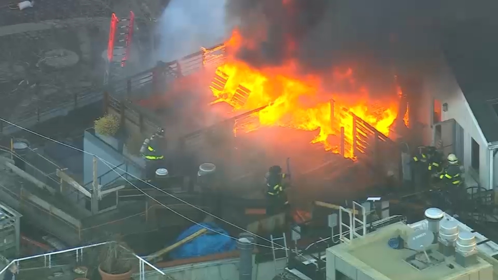 West Village fire burns through rooftop on Manhattan apartment building ...