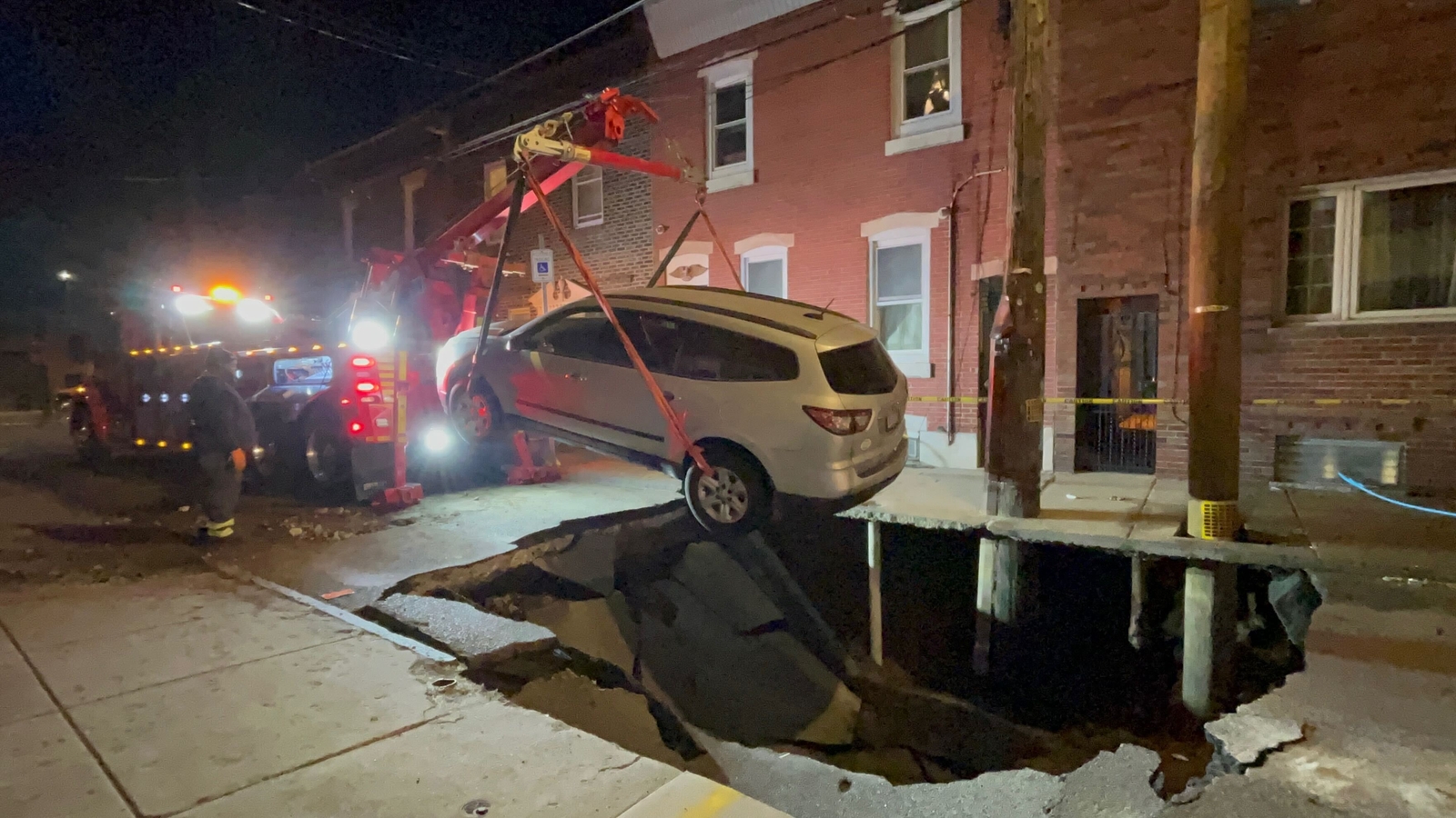 SUV removed after being swallowed by sinkhole in the Port Richmond section of Philadelphia ...