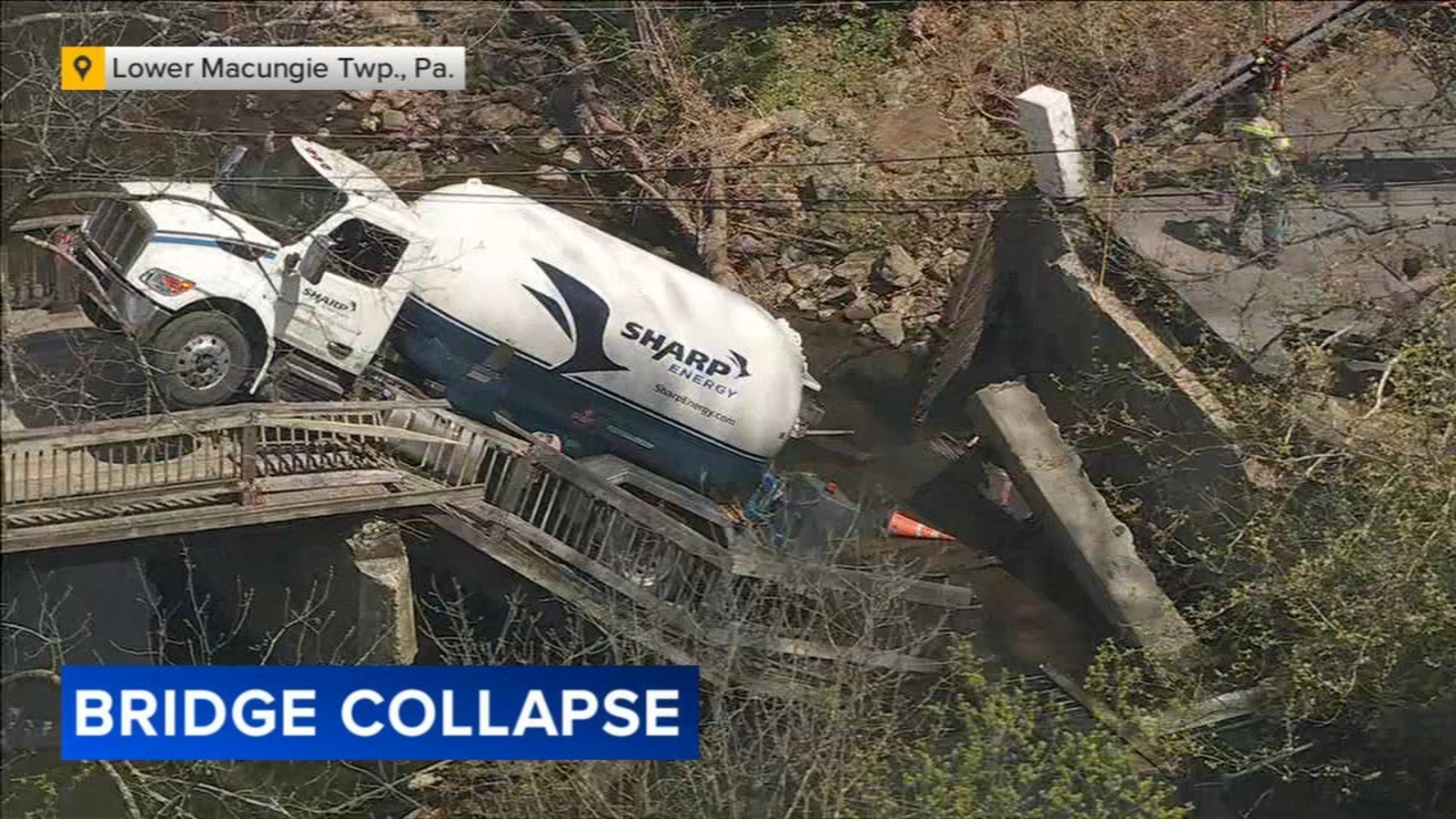 Propane truck left dangling over creek after one-lane bridge collapses ...