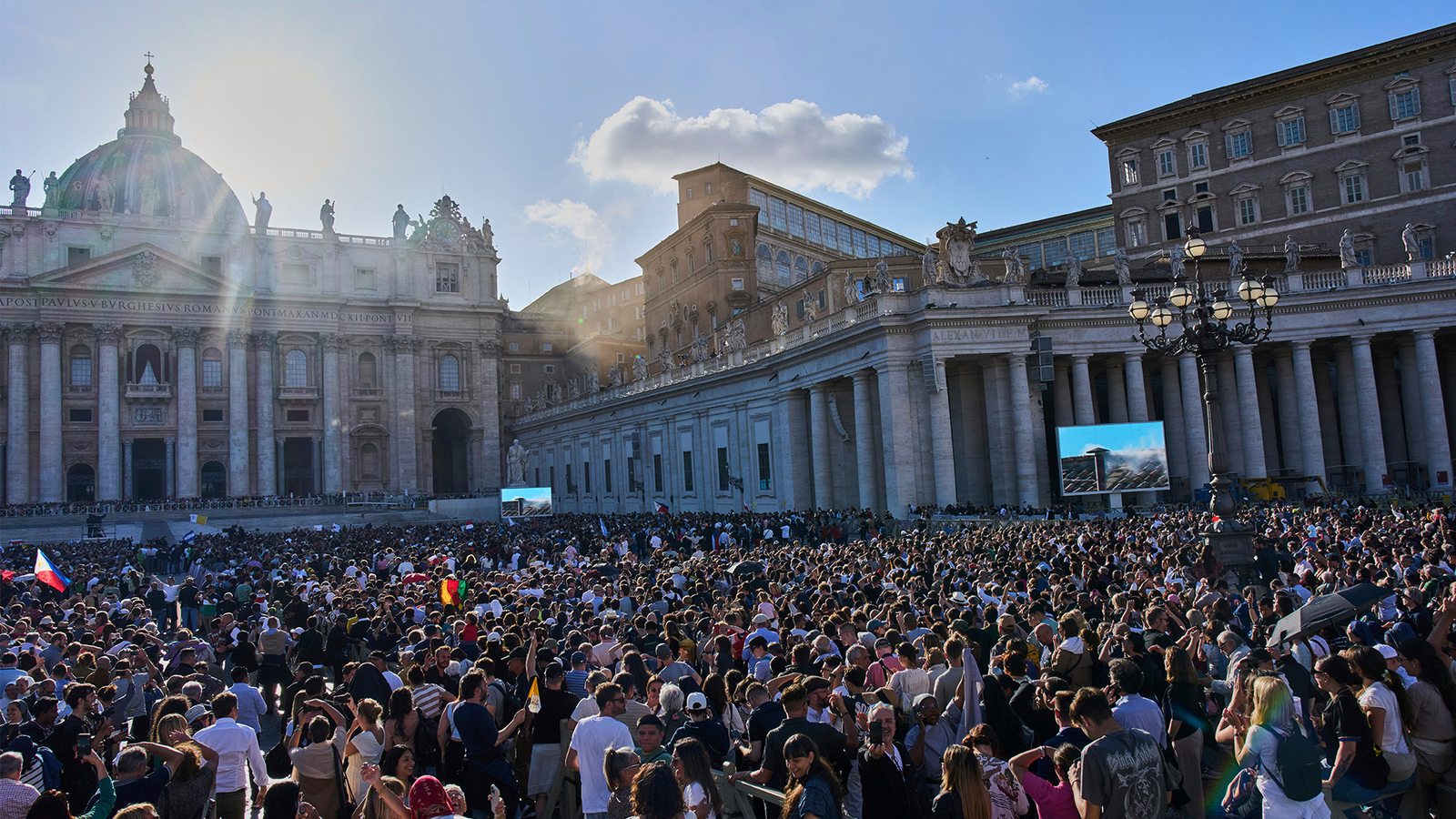 All eyes are now on the red-draped central balcony of St. Peter's ...