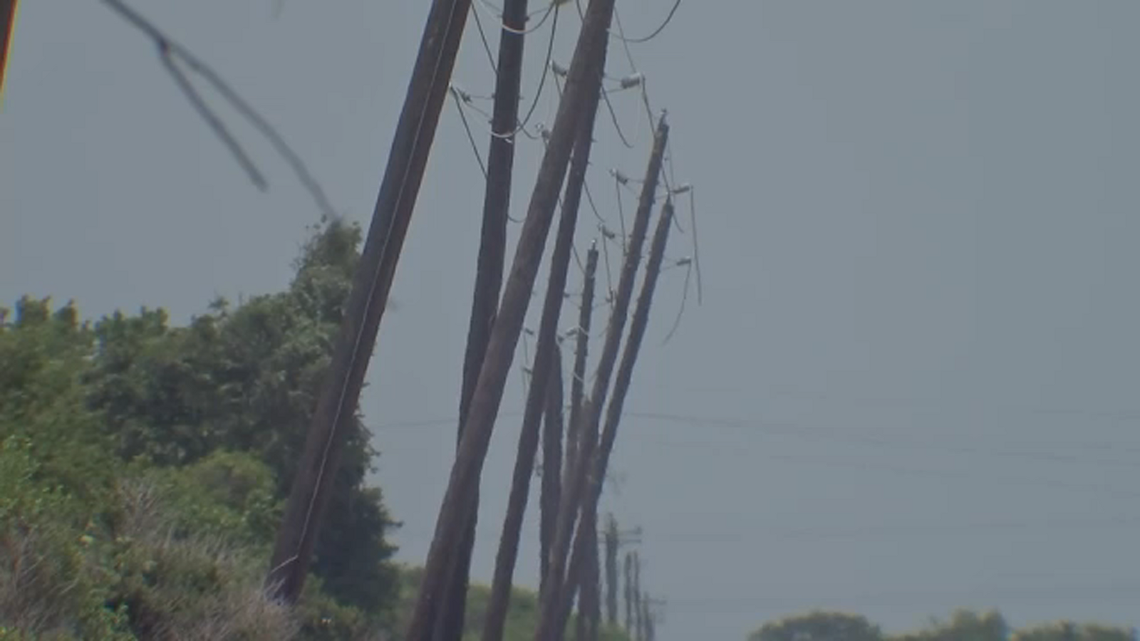 Residents say power poles are left leaning along County Road 210 in ...