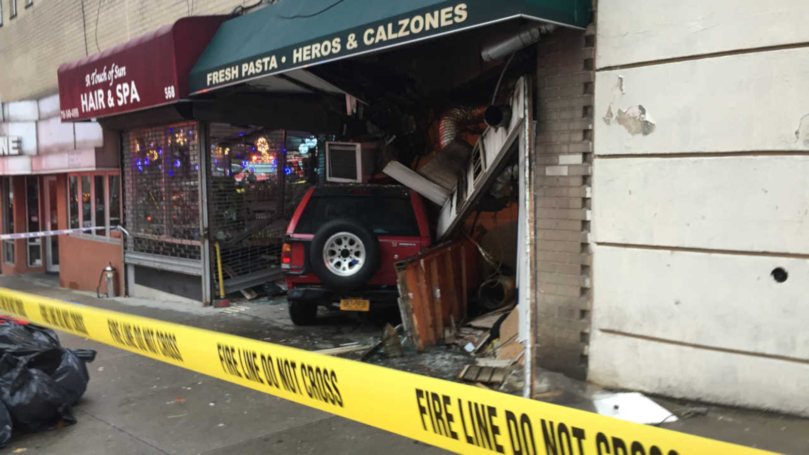 2 injured after car slams into pizzeria in the Bronx - ABC7 New York