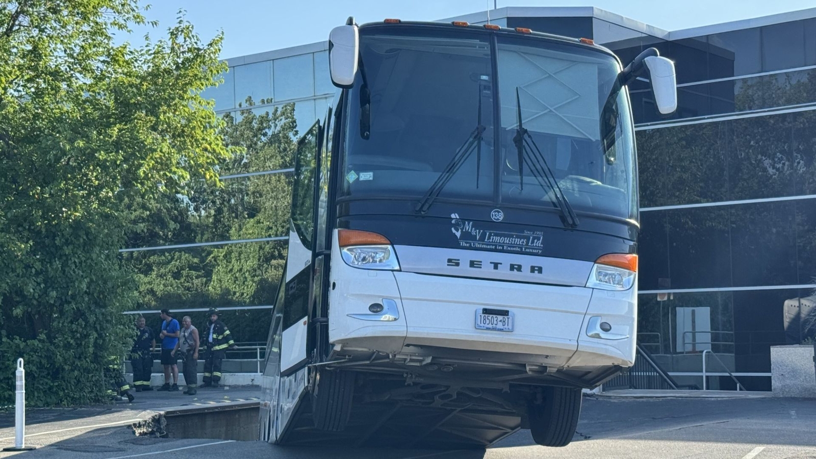 Bus falls through pavement of parking garage in North New Hyde Park ...