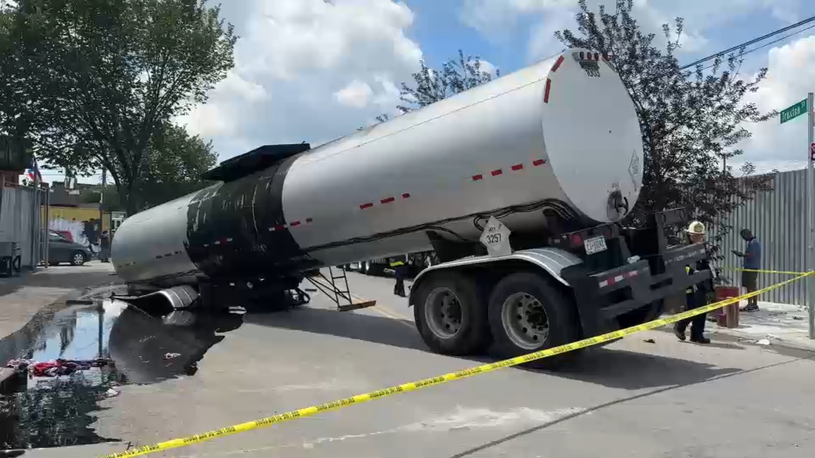 Punctured tanker truck spills out hazardous liquid asphalt in Hunts ...