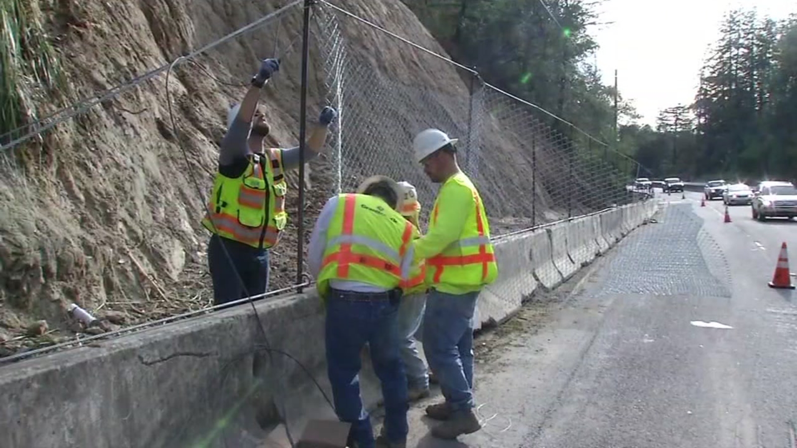 Caltrans crews install fence along Highway 17 following landslide near ...