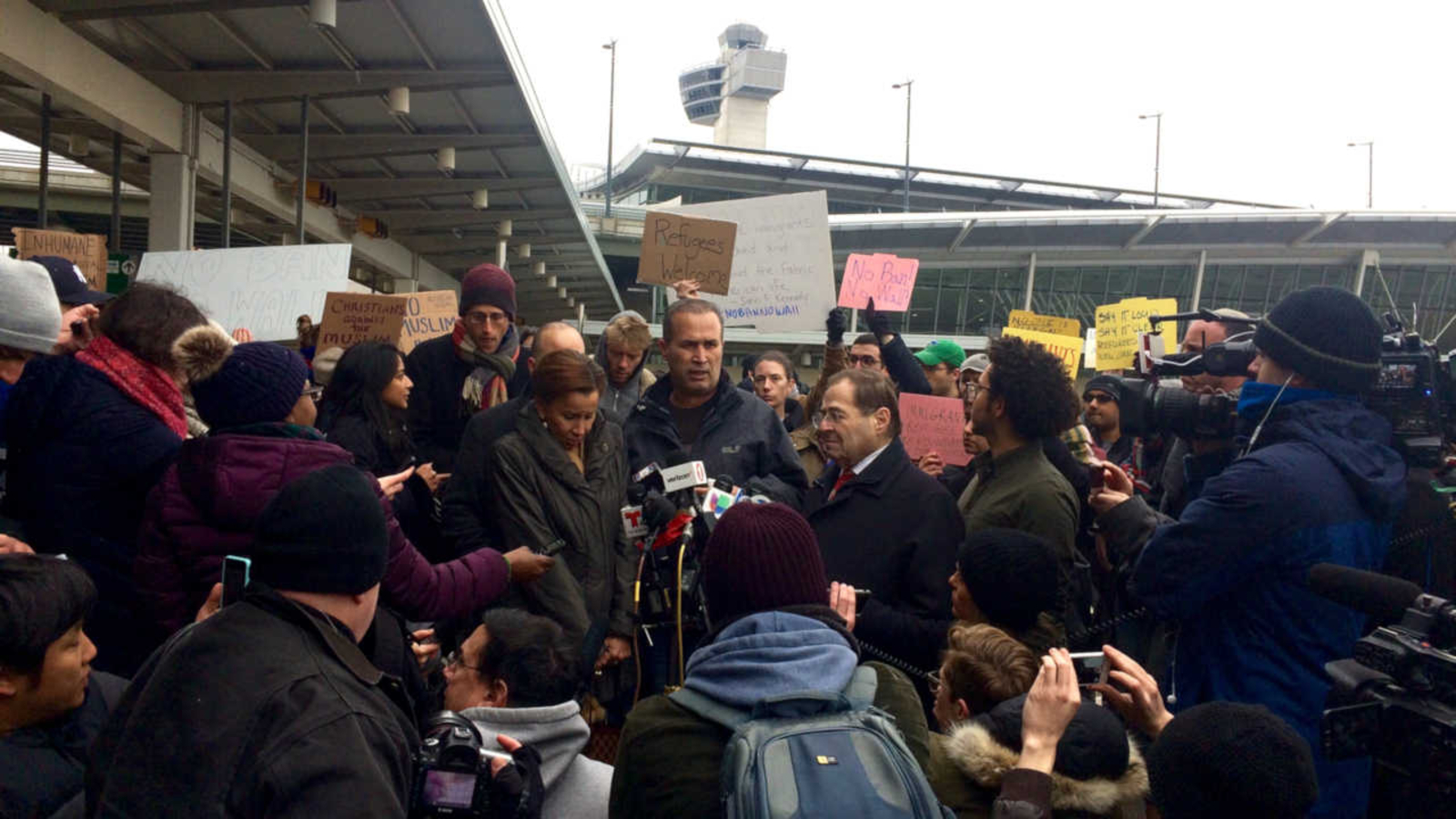 Hundreds protest after 11 detained at JFK Airport amid immigration ...