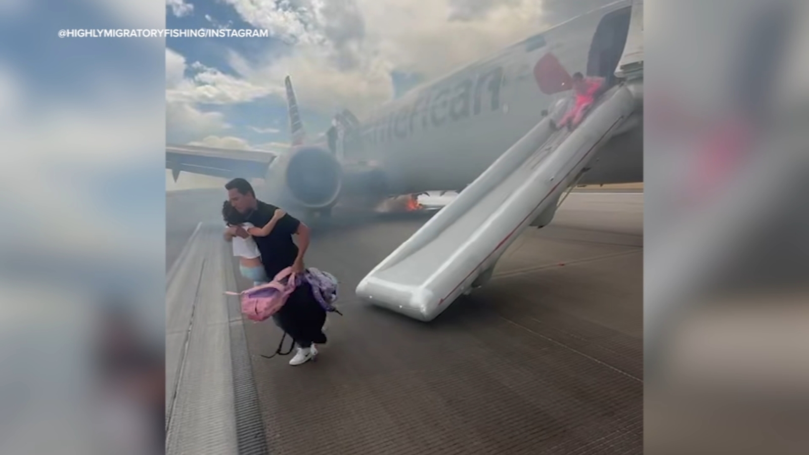 American Airlines passengers exit plane via emergency slide after ...