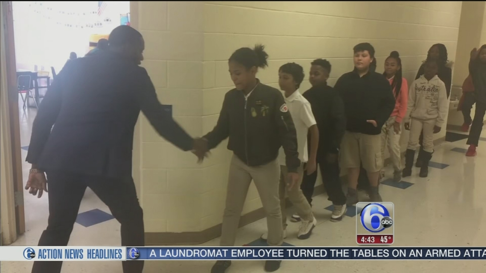 North Carolina teacher begins class with unique handshake for each ...