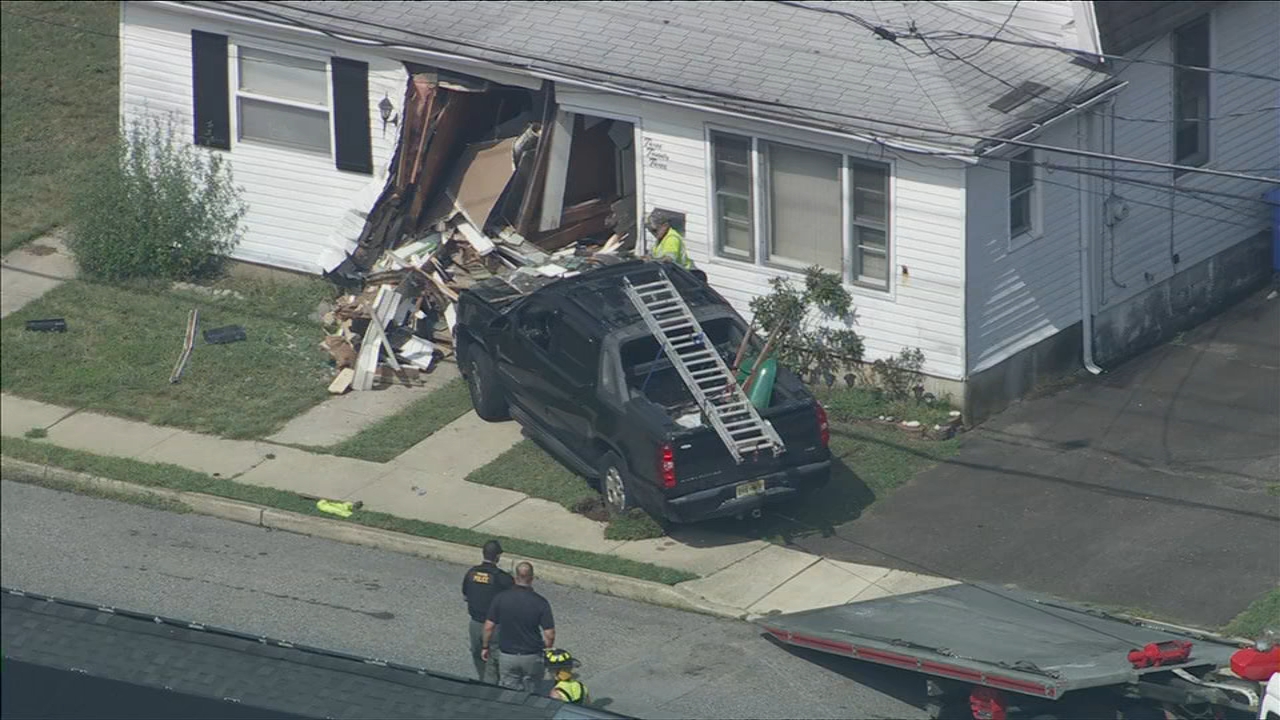 Truck Crashing Into House