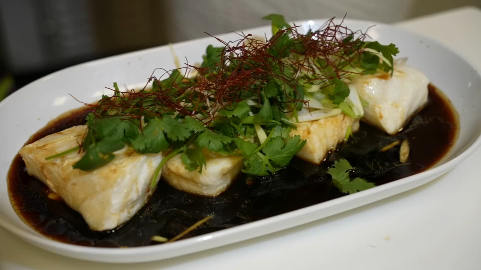 The Dish: Steamed Chilean sea bass in soy broth from Chef Nok ...