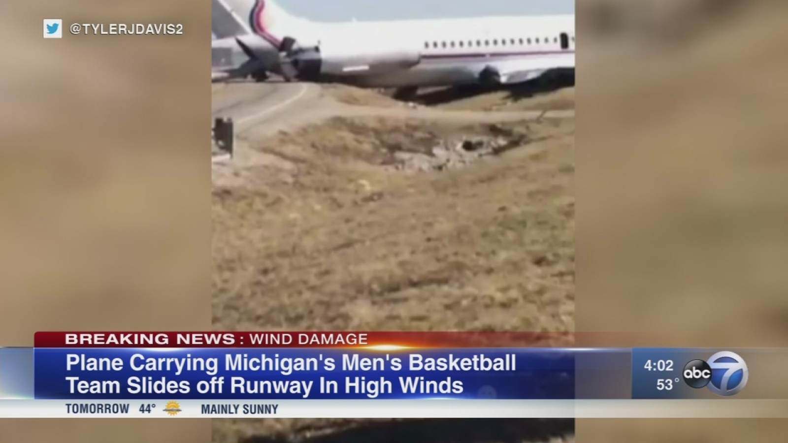 Plane carrying University of Michigan basketball team slides off runway ...