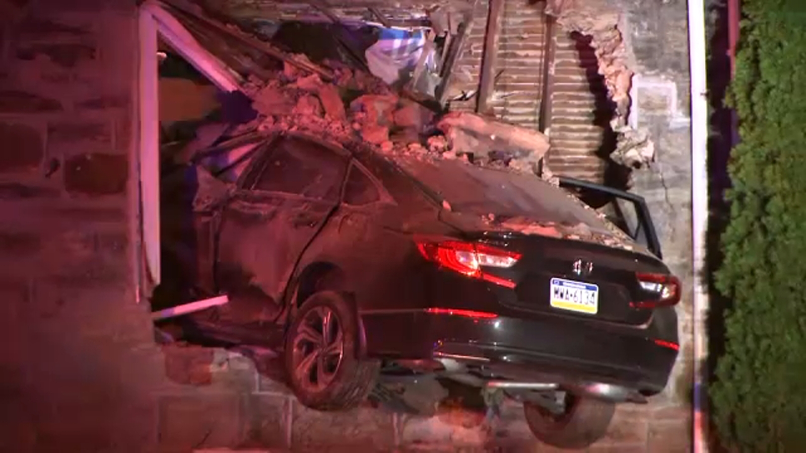 Driver runs off after car goes airborne, crashes through window home in ...