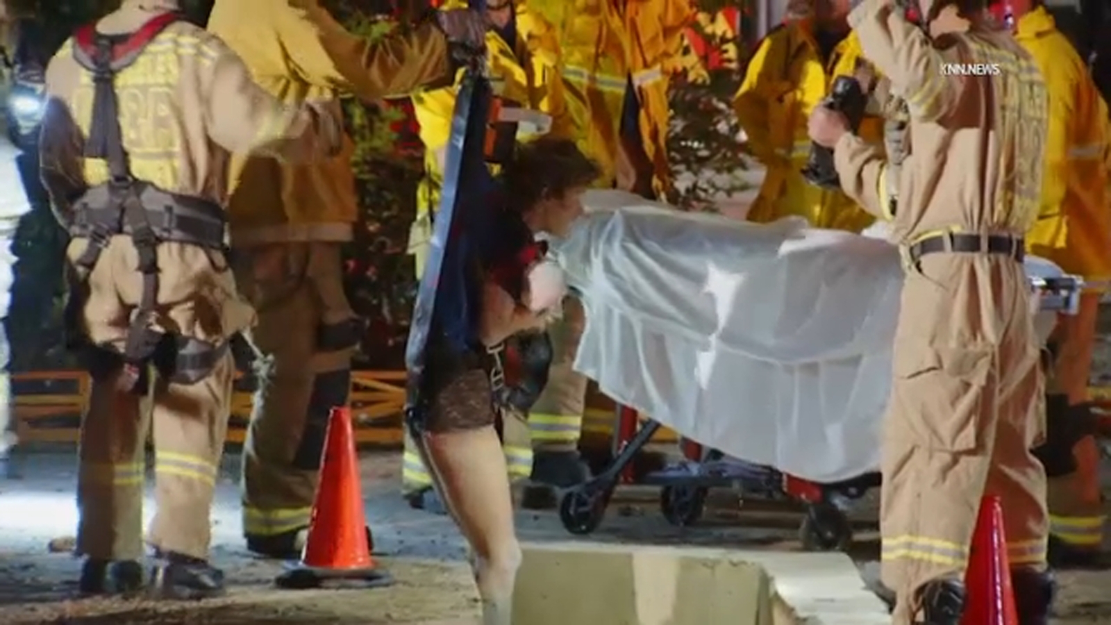 Woman rescued by LAFD firefighters after 8-foot fall into manhole in ...