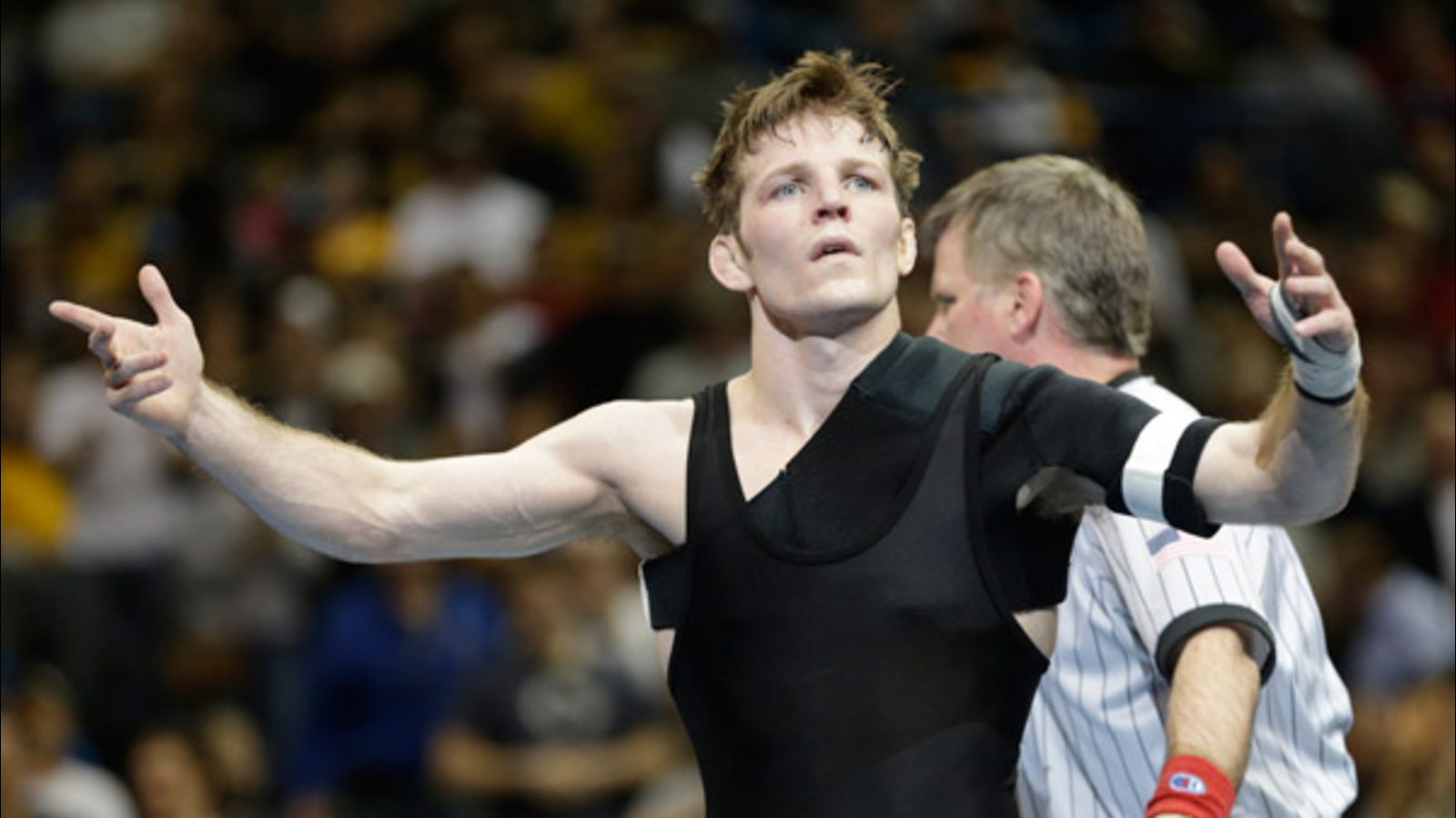 WATCH: Iowa wrestler wins national title, tosses assistant coach - ABC7 ...