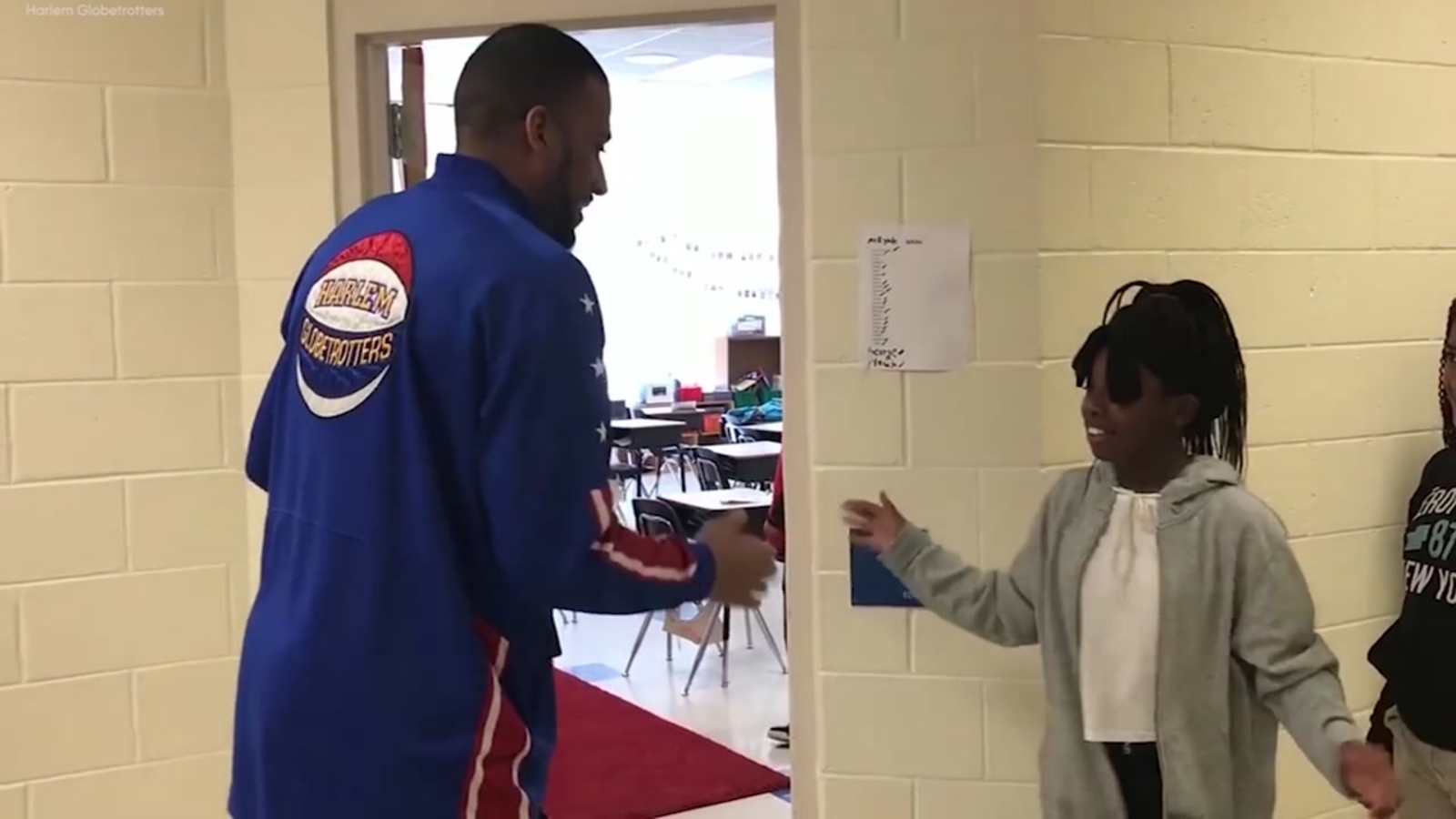 Harlem Globetrotter visits teacher known for unique handshakes - ABC30 ...