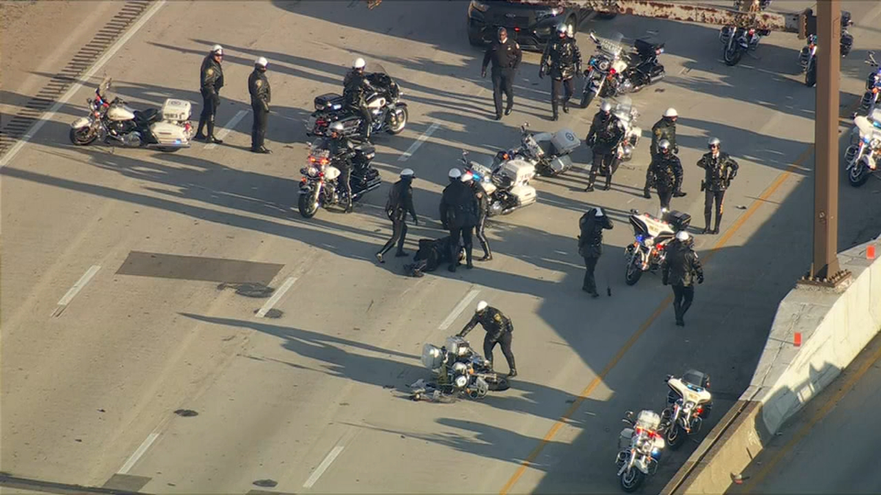Motorcycle cop crashes during Camp Out for Hunger procession on I-95 ...