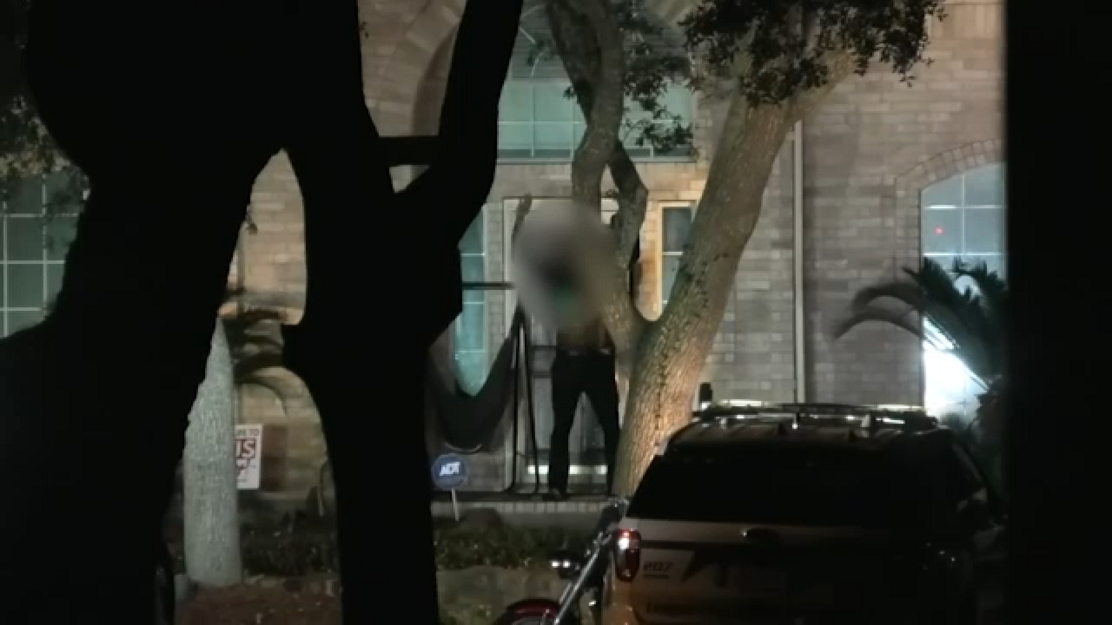 Tense standoff between officers and armed suspect inside house with ...