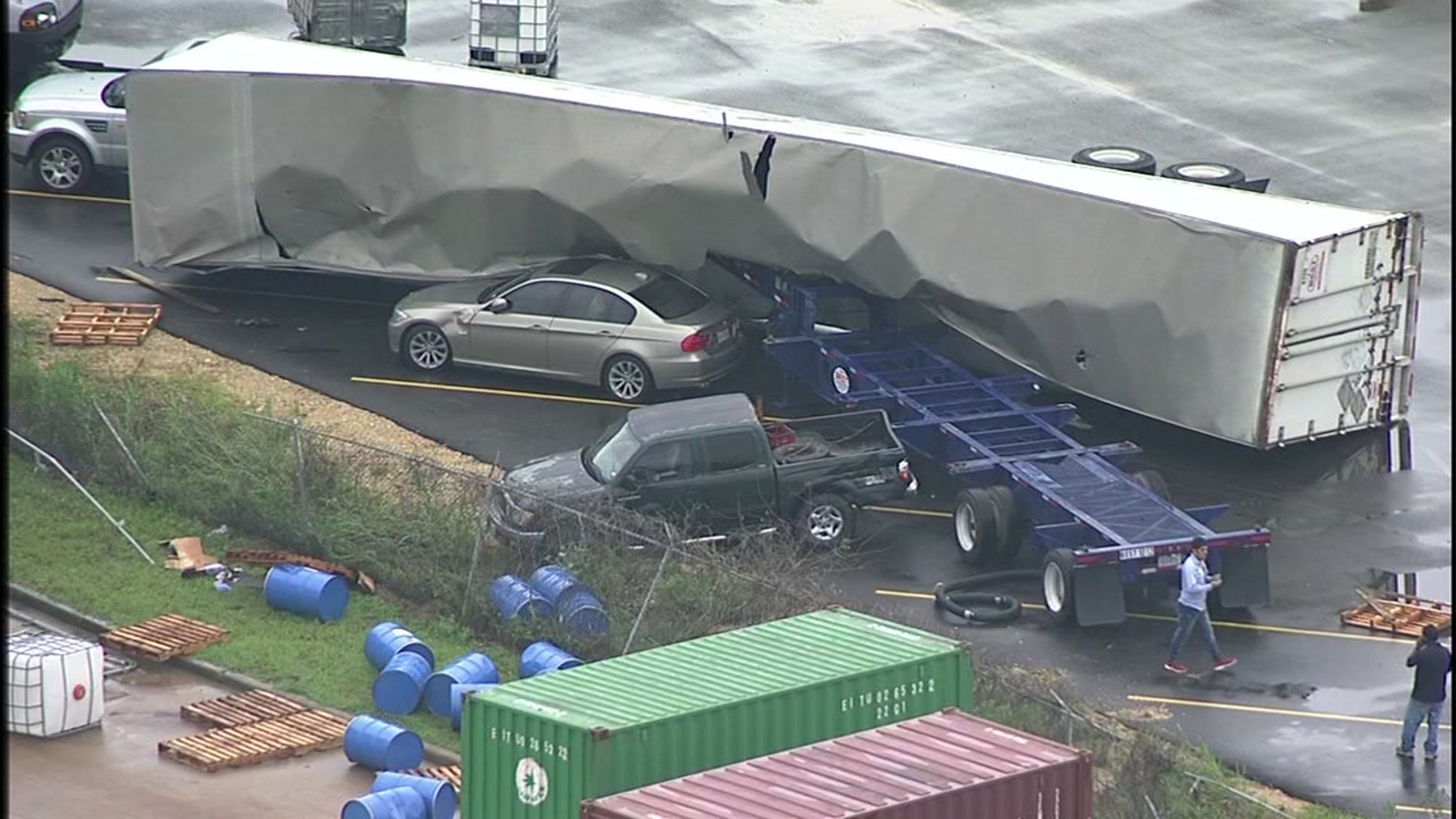 Storms toppled shipping containers, flipped cars and flooded streets ...